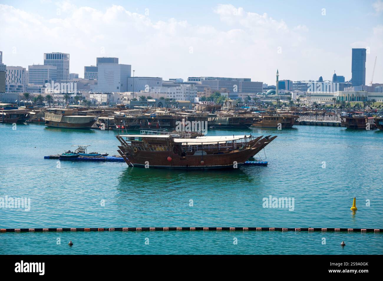 Doha, Qatar - January 24, 2025: Traditional boats at the Dhow Harbor in ...