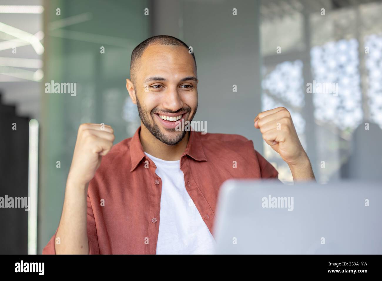 Man close up celebrating successful achievement results, employee ...