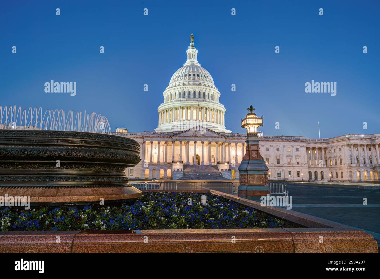 The illuminated U.S. Capitol Building in Washington D.C. at dawn with a ...