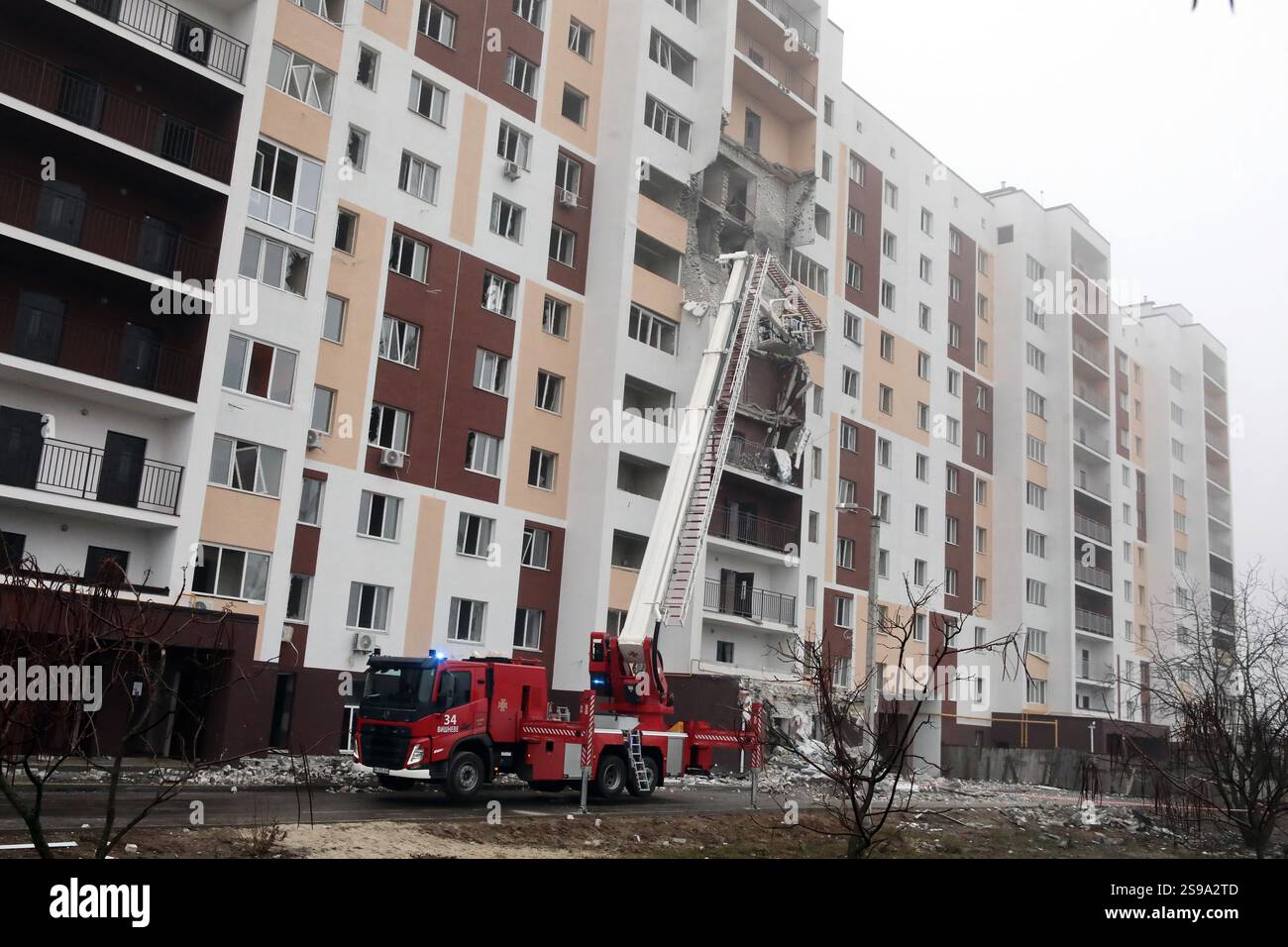 VYSHNEVE, UKRAINE - JANUARY 25, 2025 - Rescuers use an aerial lift to reach the floors of an ...