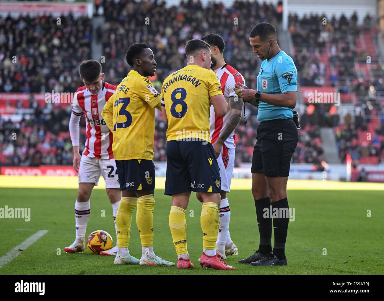 Oxford United's Cameron Brannagan reacts as he receives a yellow card ...