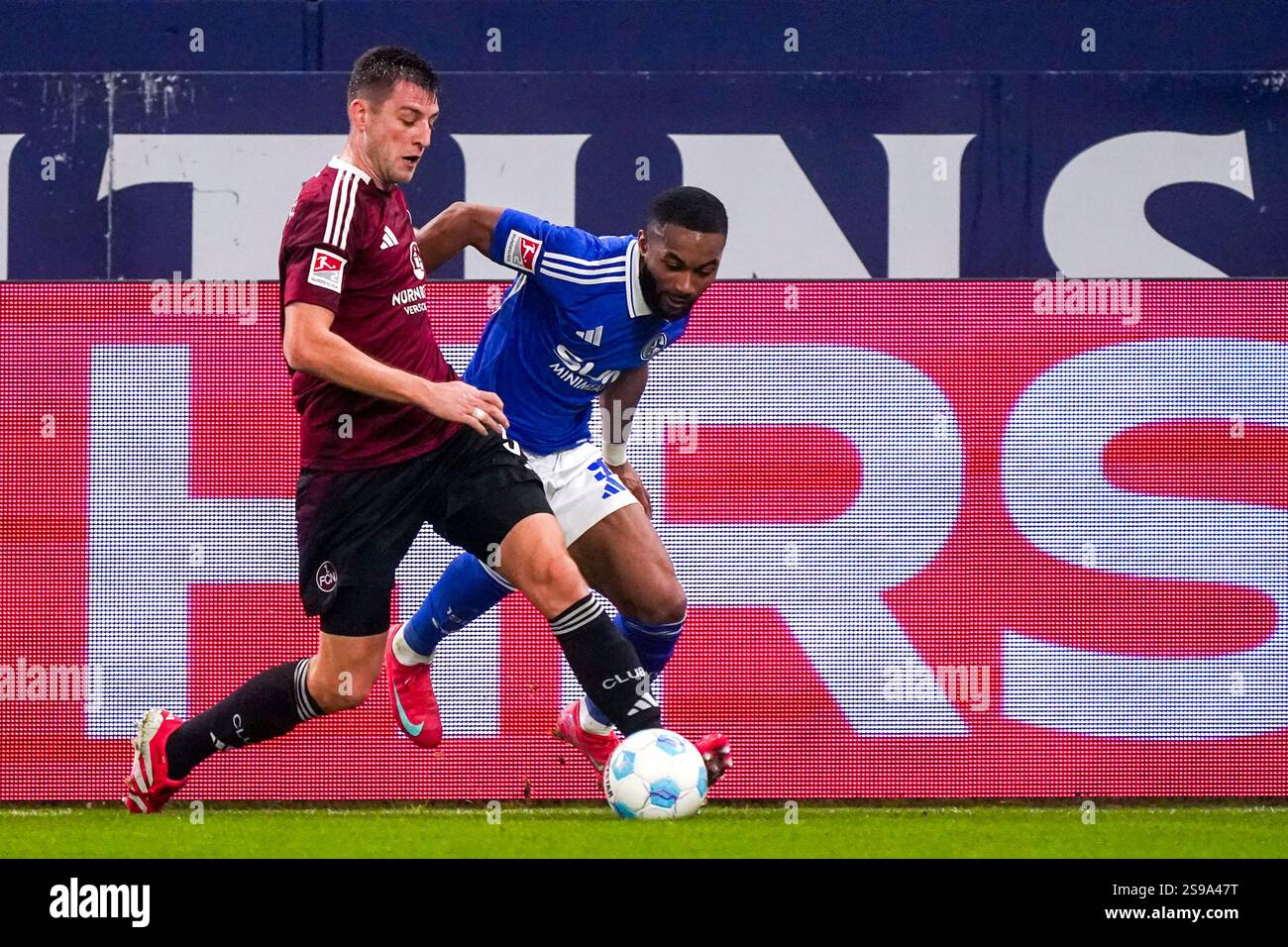 GELSENKIRCHEN, NETHERLANDS - JANUARY 25: Robin Knoche of 1. FC Nurnberg battles for possession ...