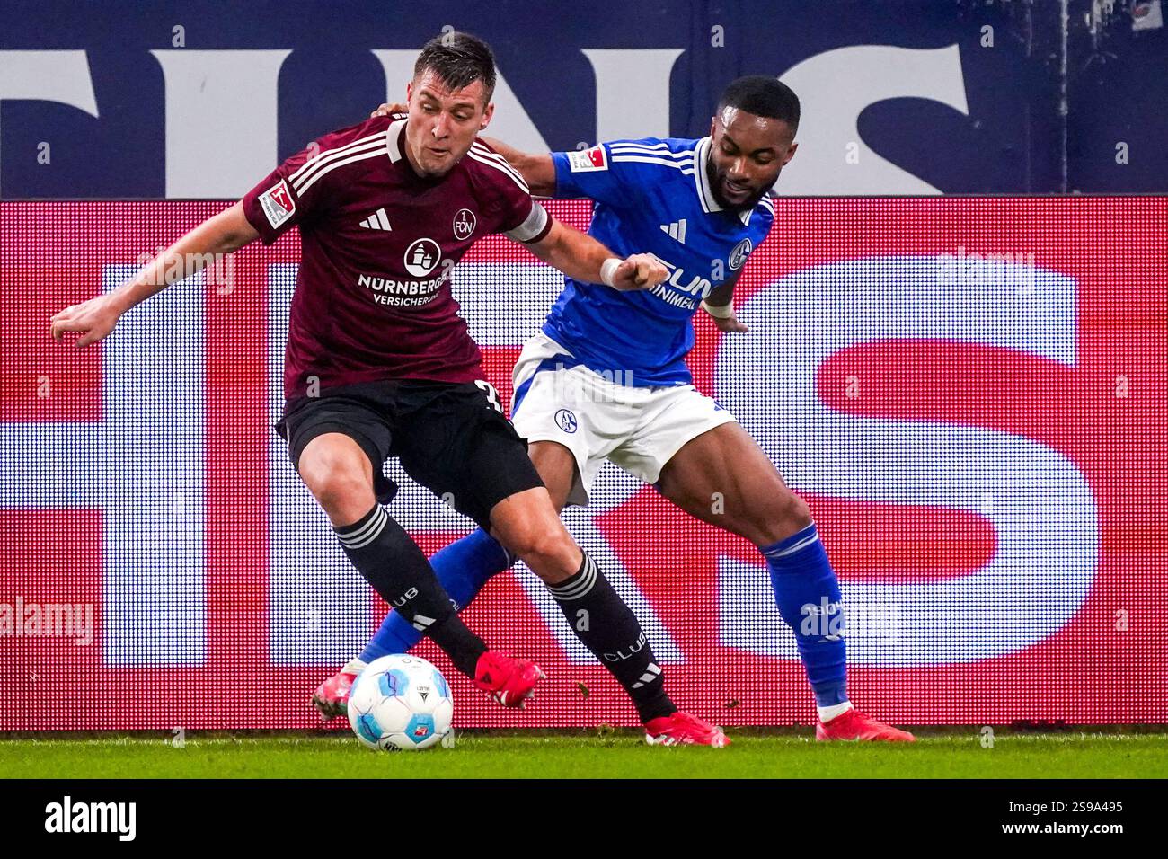GELSENKIRCHEN, NETHERLANDS - JANUARY 25: Robin Knoche of 1. FC Nurnberg battles for possession ...
