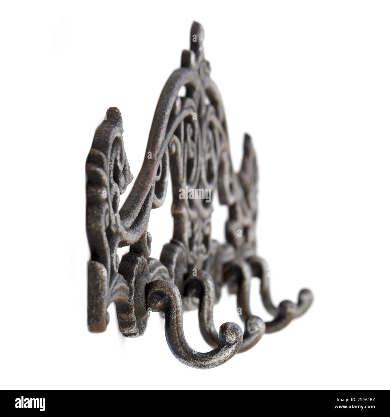 Antique metal hanger. Isolated picture Stock Photo - Alamy