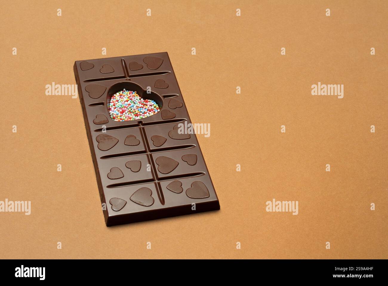 Chocolate bar with heart shape Stock Photo - Alamy