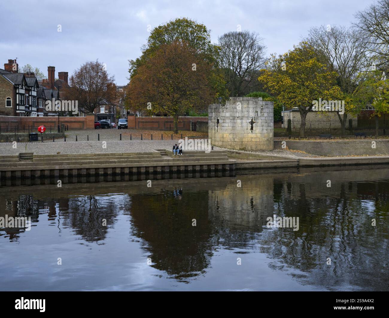 Marygate Water Tower ruin on the banks of River Ouse (view across water ...