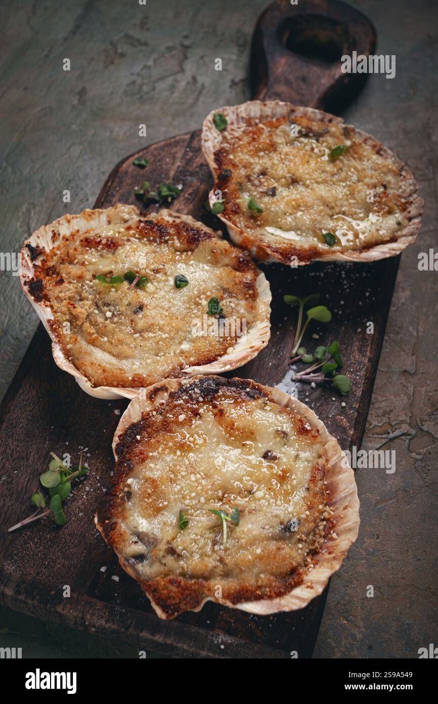 Scallop shells, stuffed, baked with cheese, in the oven, julienne with ...