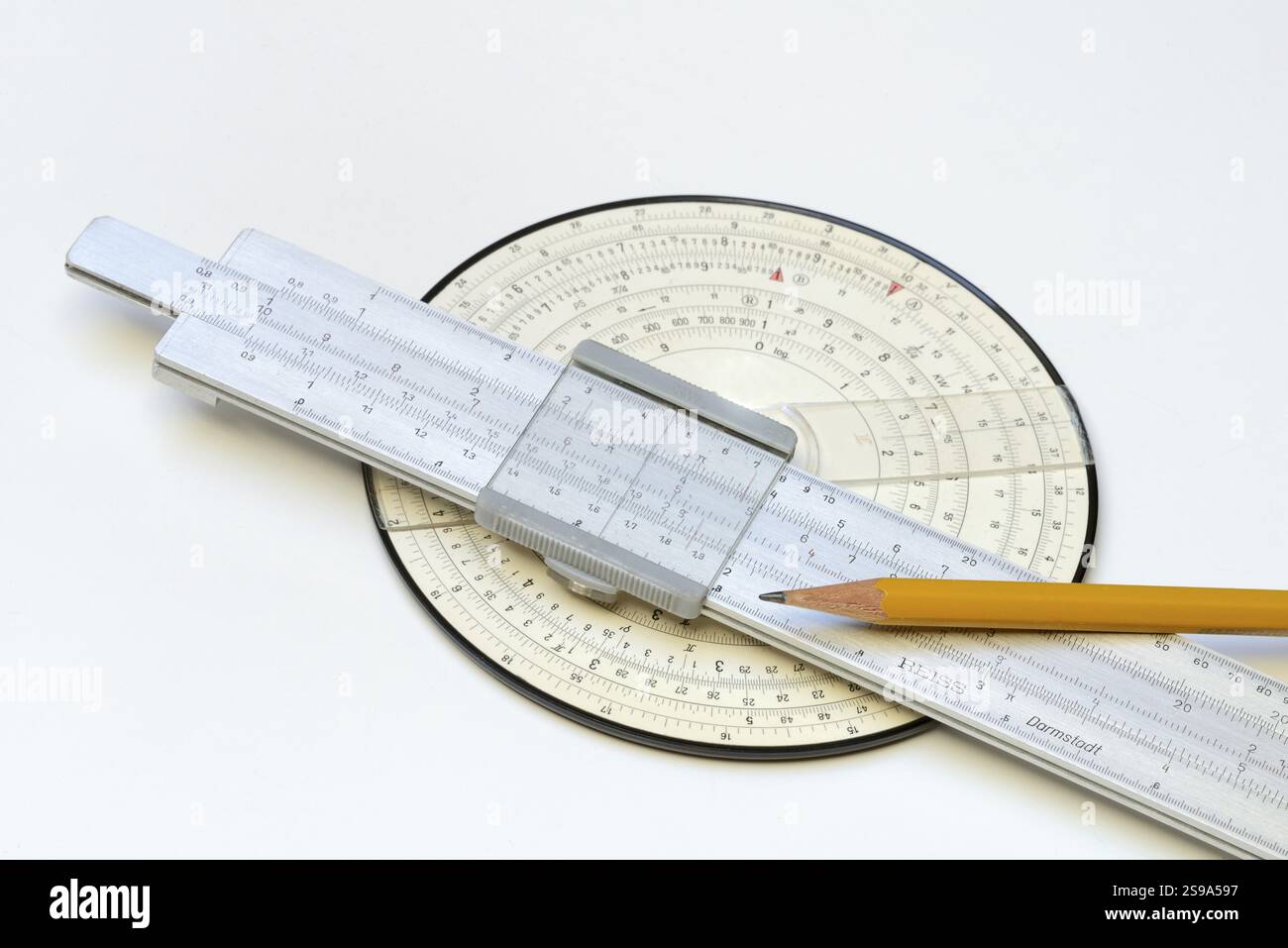 Slide rule and calculating disc, calculating aids Stock Photo - Alamy