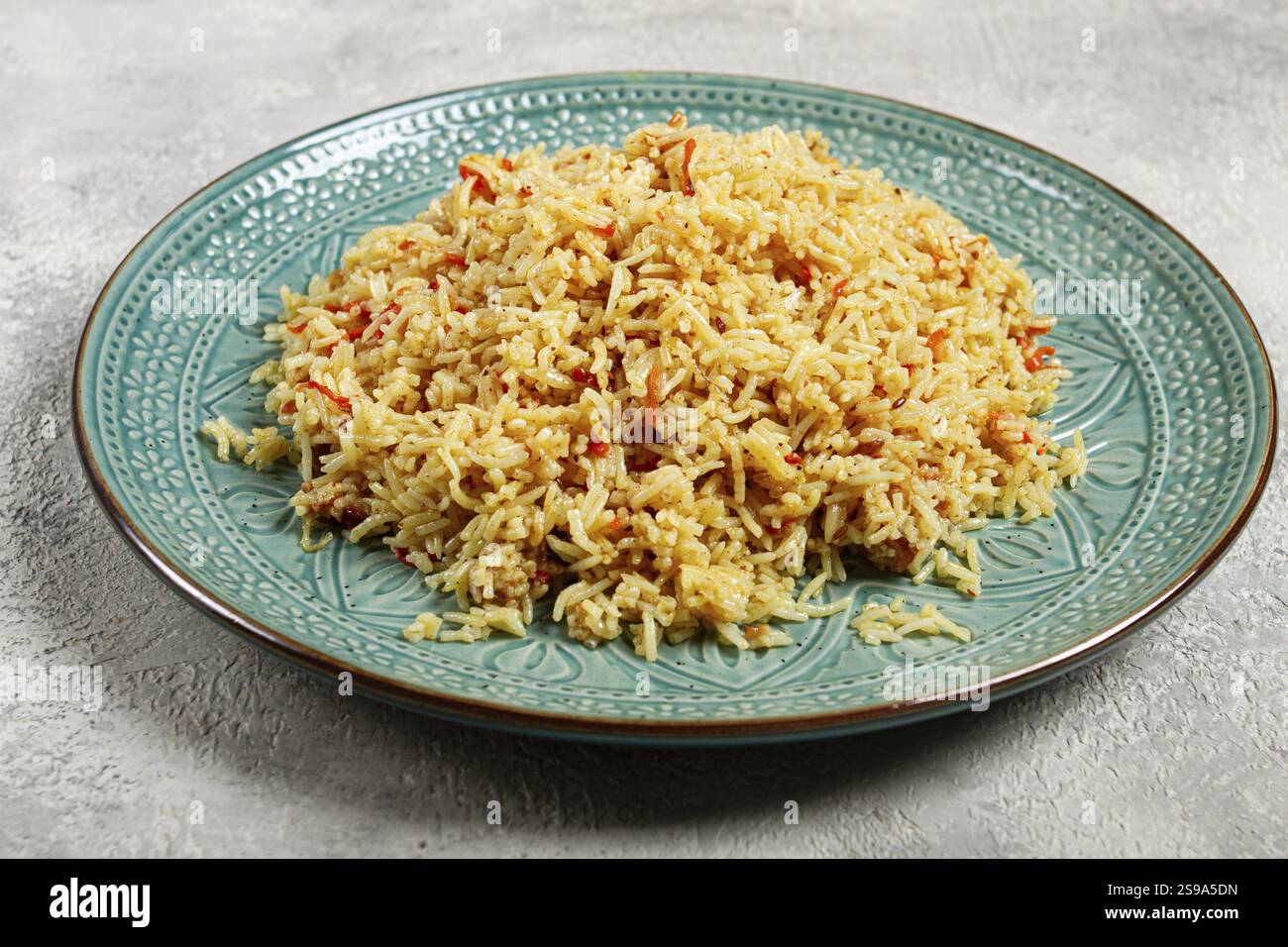 Basmati rice with saffron, on a decorative blue plate, light background ...