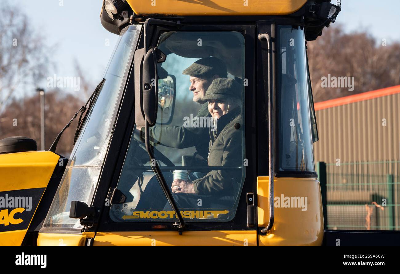 A tractor driver and passenger, as farmers gather at Selby Livestock ...