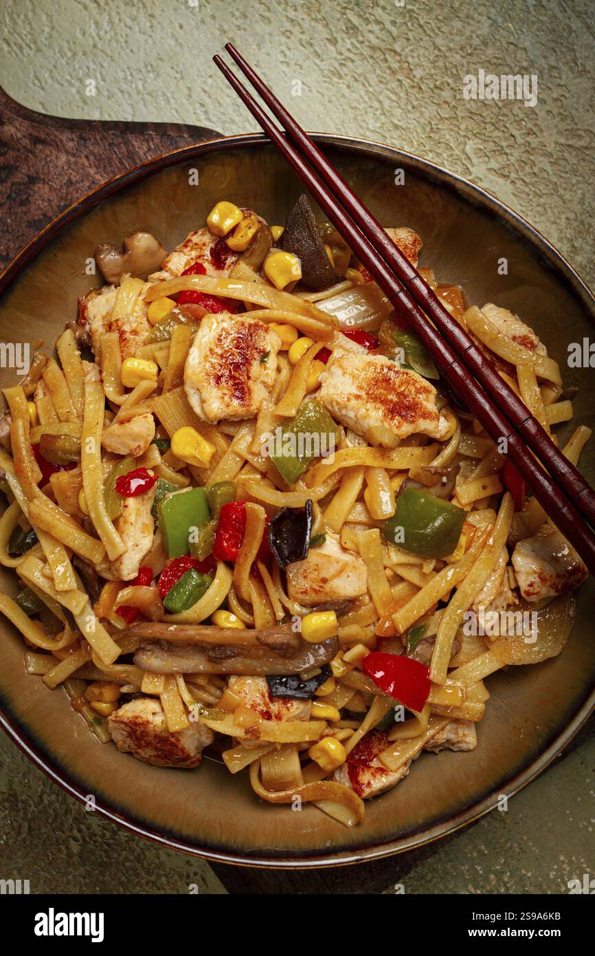 Fried noodles with chicken meat and vegetables, Bami Goreng, Indonesian ...