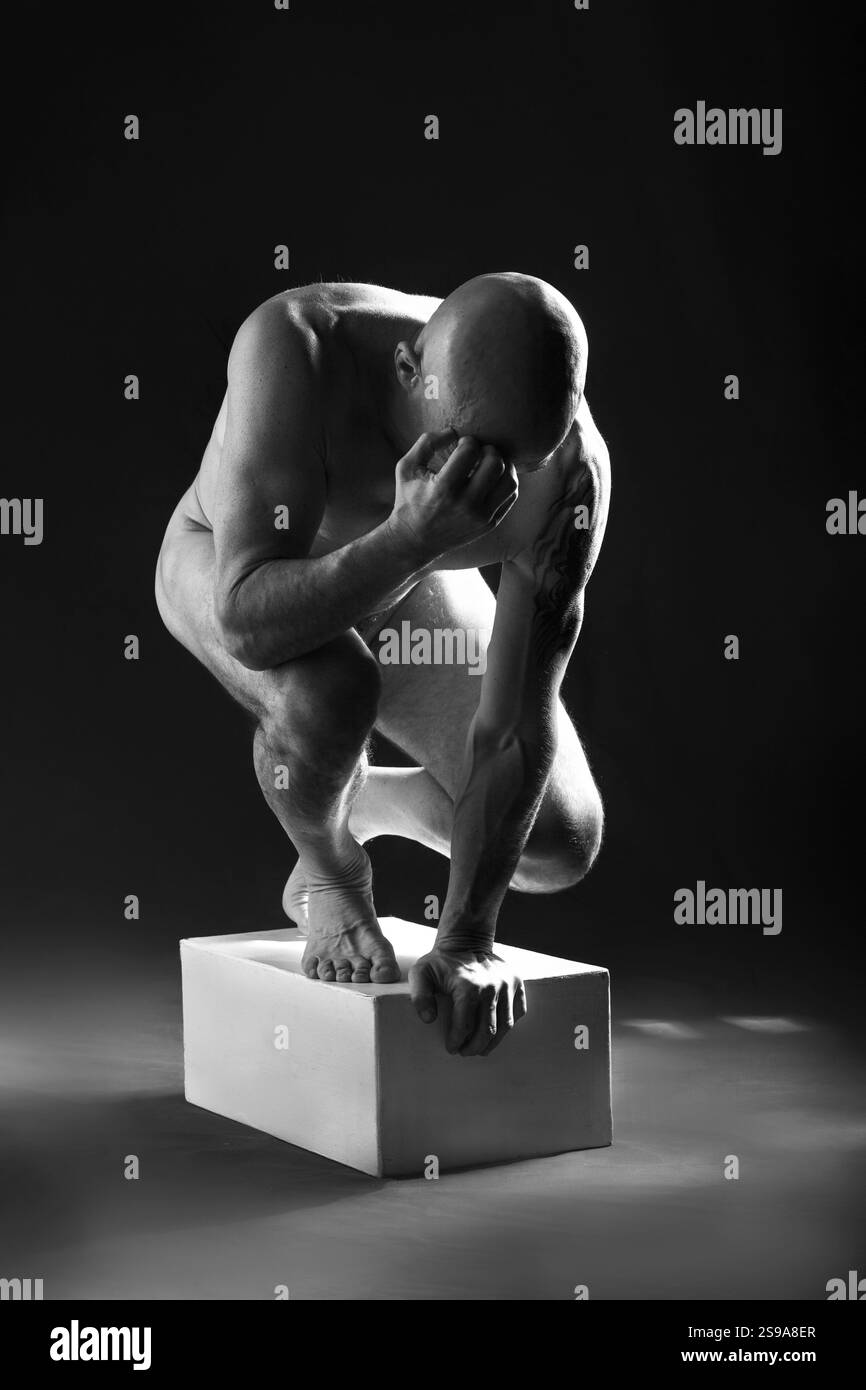 Studio portrait of athletic man. Body sculpture. Monochrome photo Stock ...