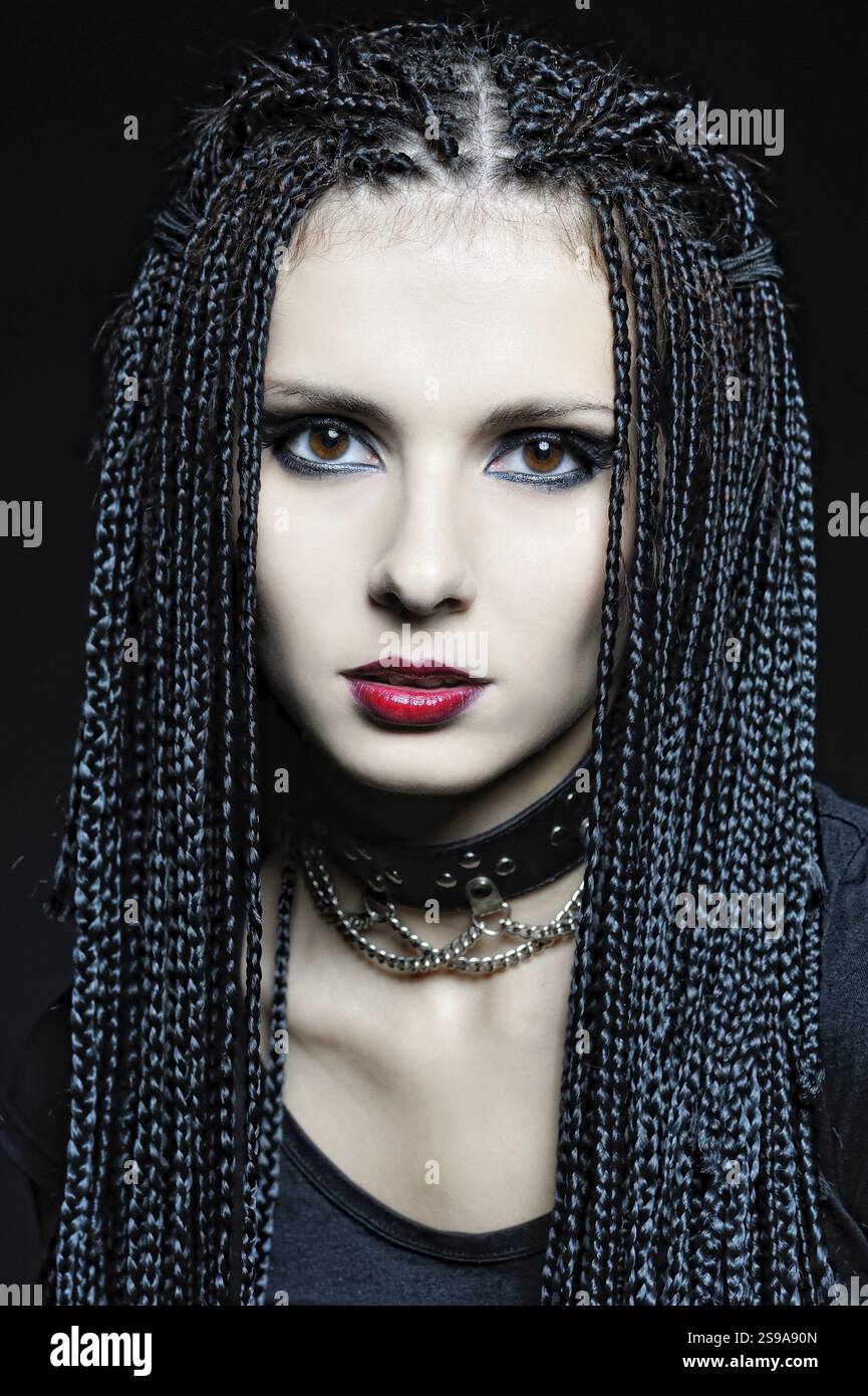 Beautiful woman in gothic form with African braids Stock Photo - Alamy
