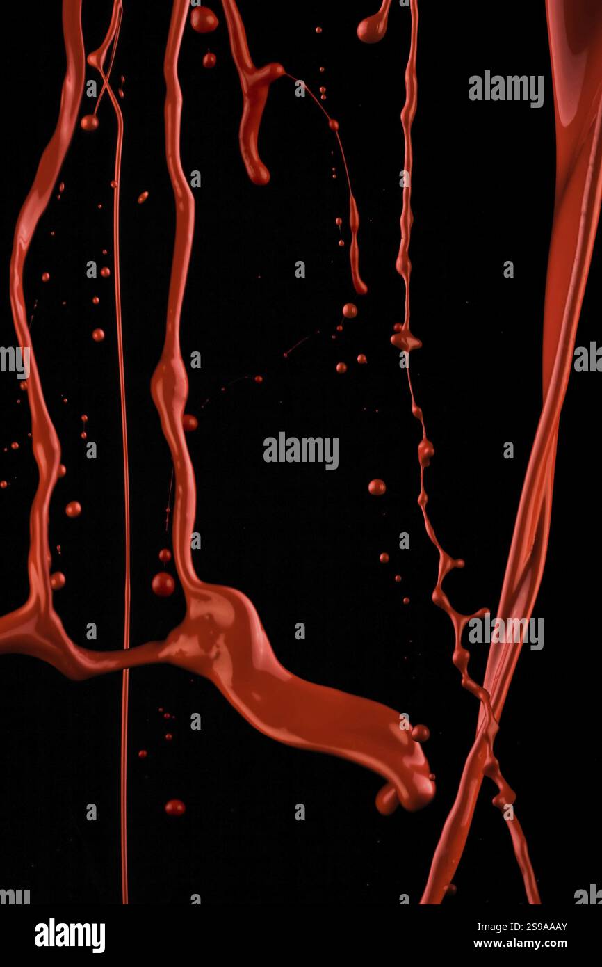 Blood flowing down in streams and drops, isolated against a black ...
