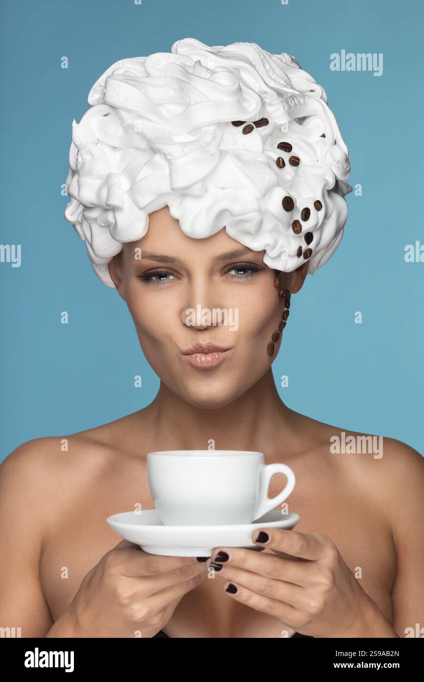 A young lady with whipped cream on her head and a coffee cup Stock ...