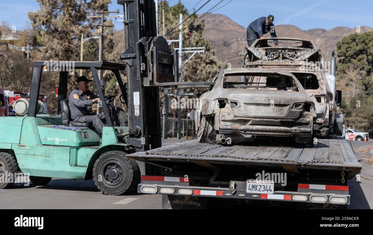 January 24, 2025, Pacific Palisades, California, USA: Tow Trucks remove ...