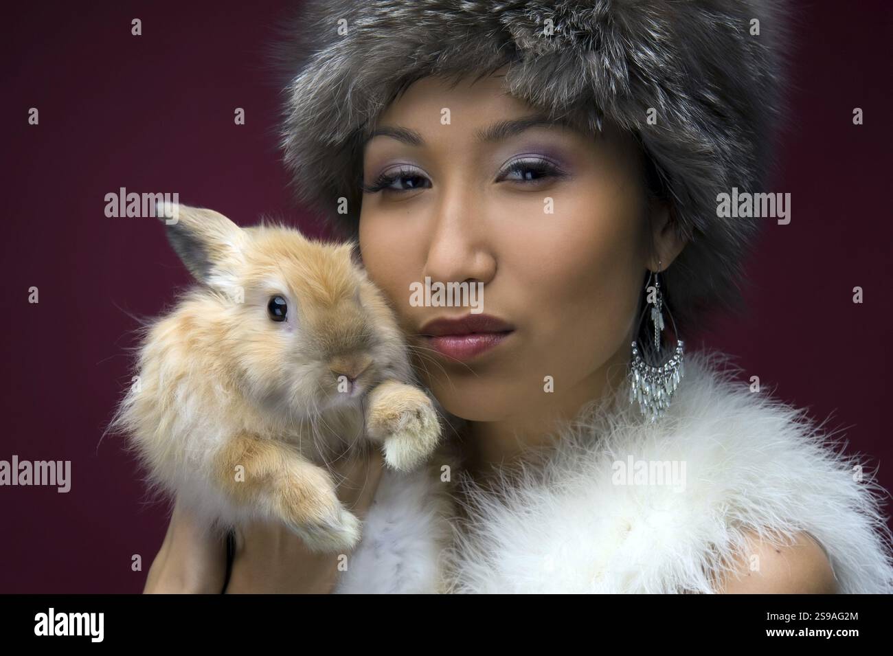 Portrait of beautiful woman with fluffy rabbit, ST. Petersburg, Russia ...