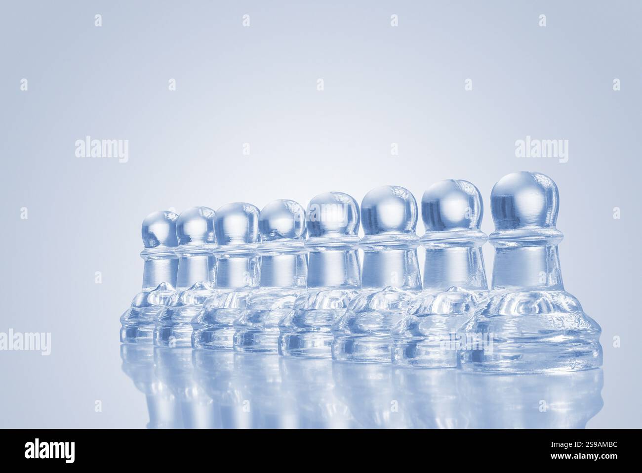 A raw material made of transparent glass figures on a reflective ...