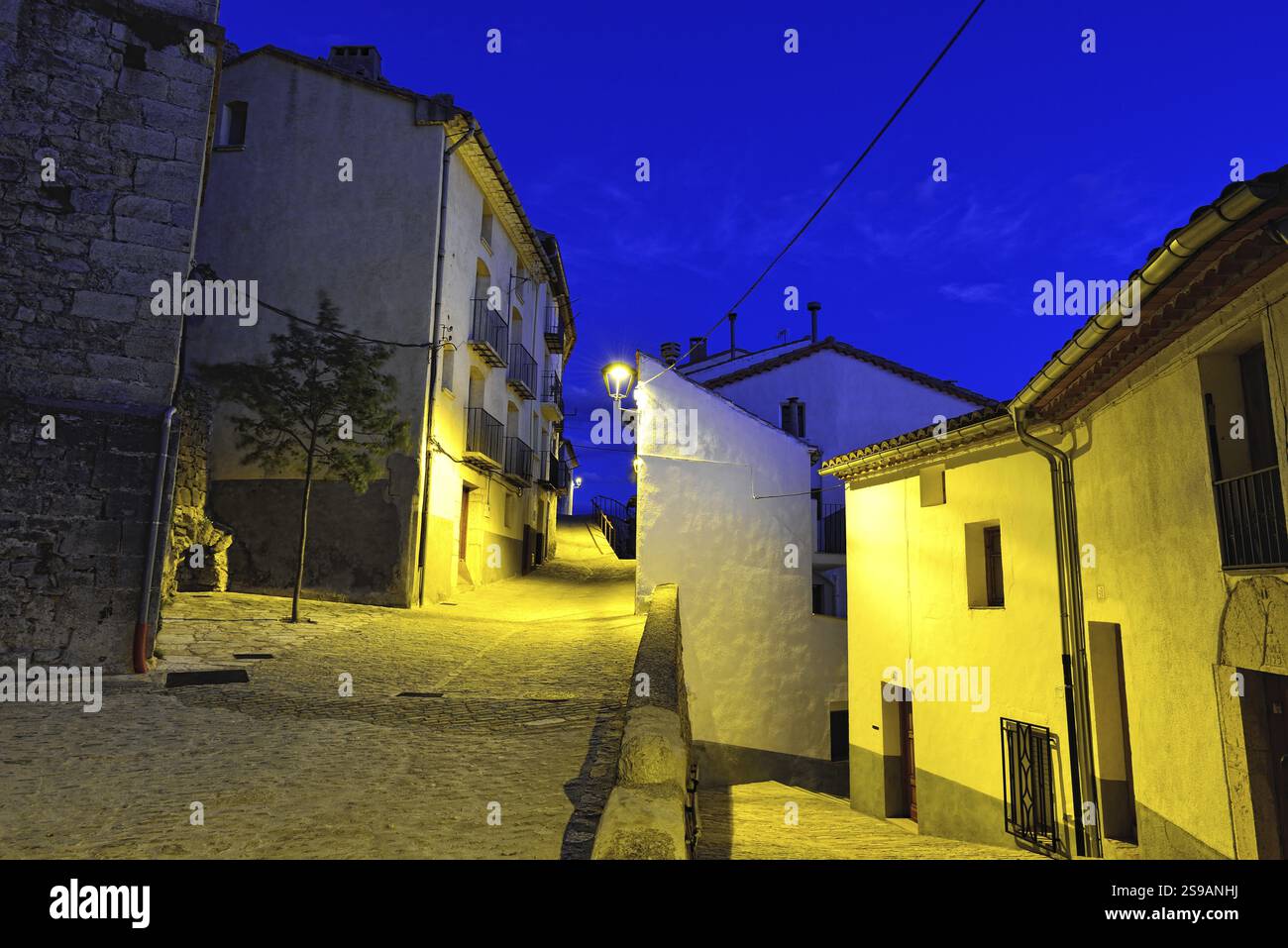 Streets of the old town centre of Ares in Spain. Evening time. Darkness ...
