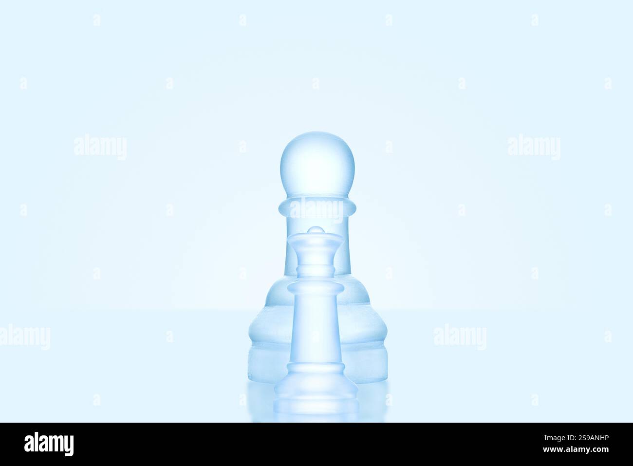 Chess game concept of a single icy, frozen pawn standing alone on an ...