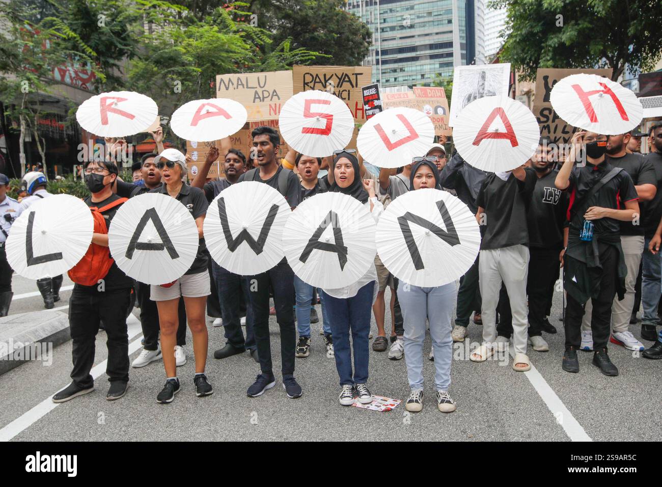 Protesters hold placards during the anti-corruption rally named 'The ...