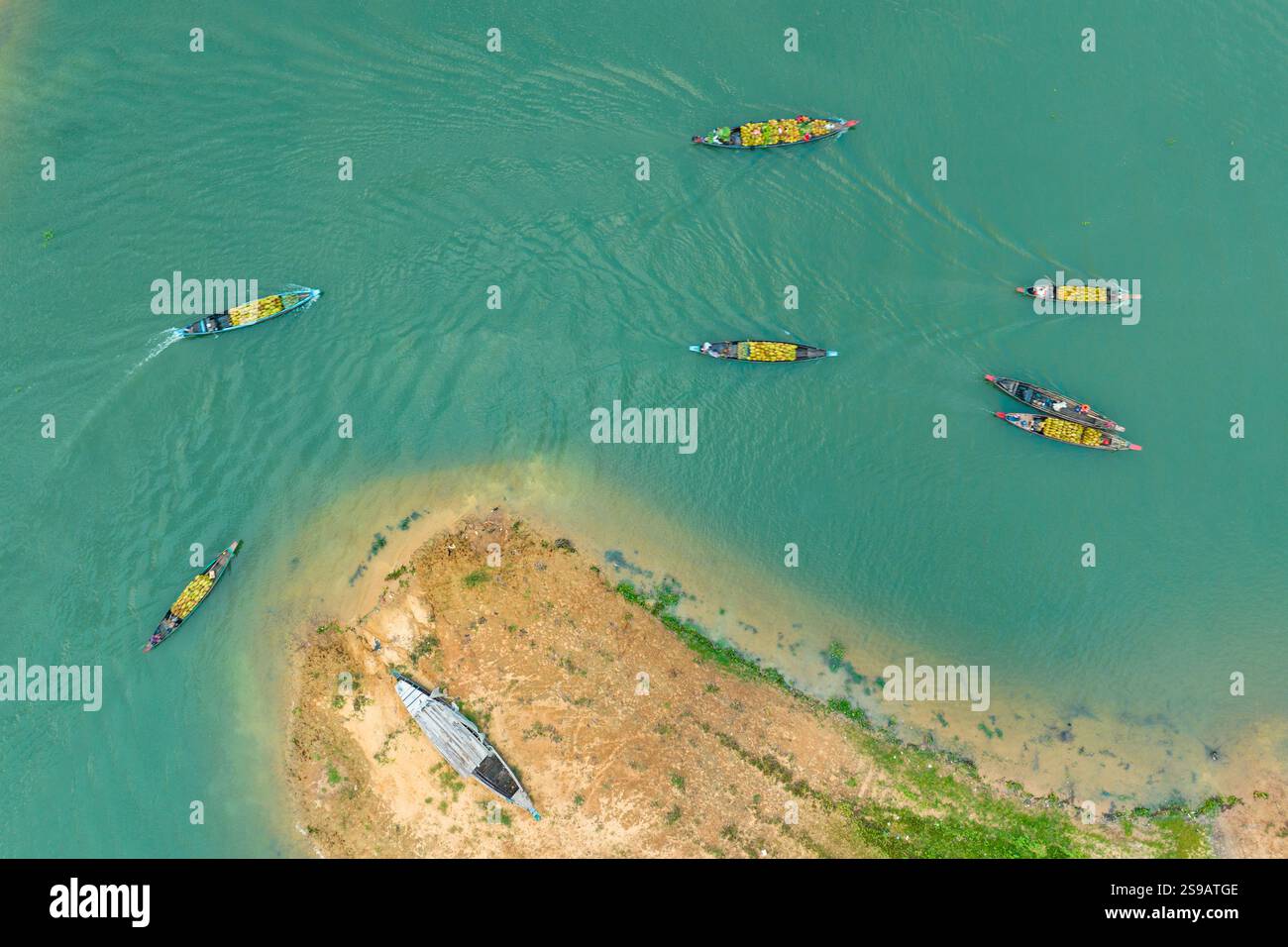 Aerial view of floating market of seasonal fruits on the boats in ...