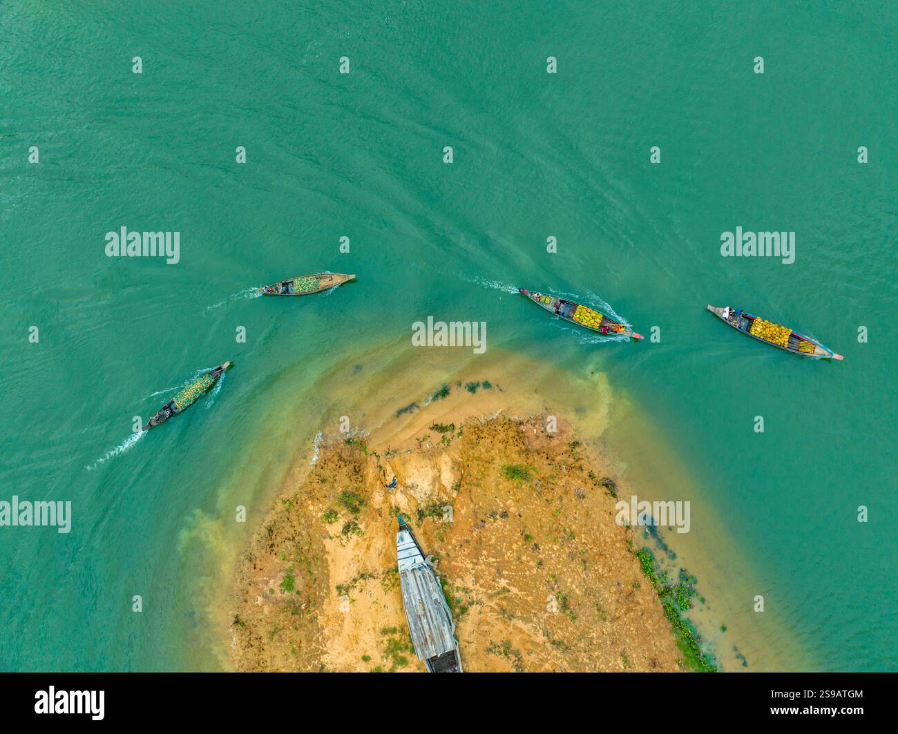 Aerial view of floating market of seasonal fruits on the boats in ...