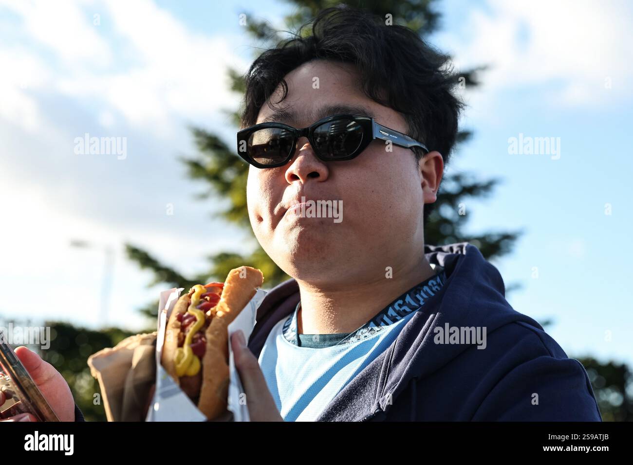 A fans having a hotdog during the Premier League match Manchester City ...