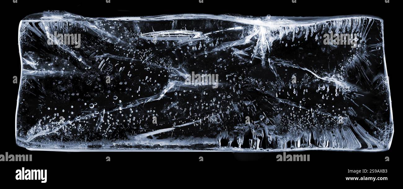 Large rectangle of clear ice with bubbles, on black Stock Photo - Alamy