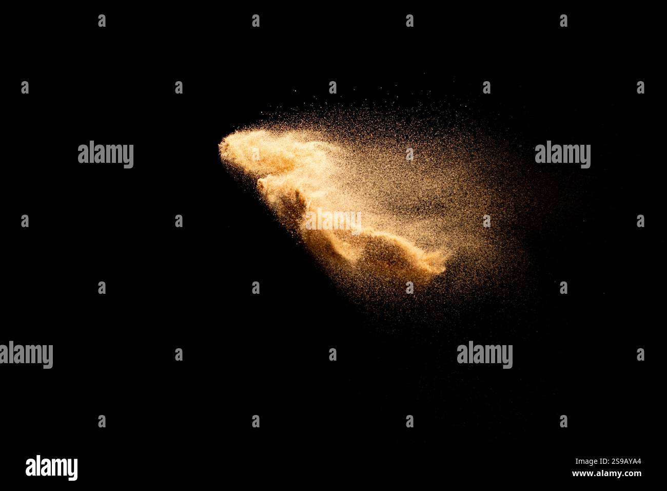 Sand flying explosion isolated on black background ,throwing freeze ...