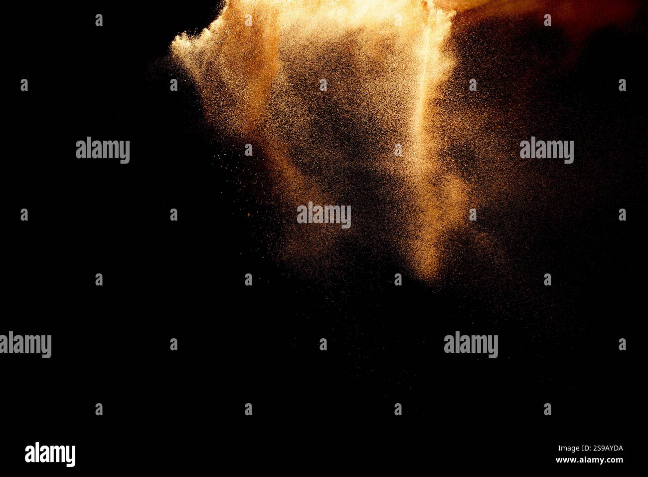 Sand flying explosion isolated on black background ,throwing freeze ...