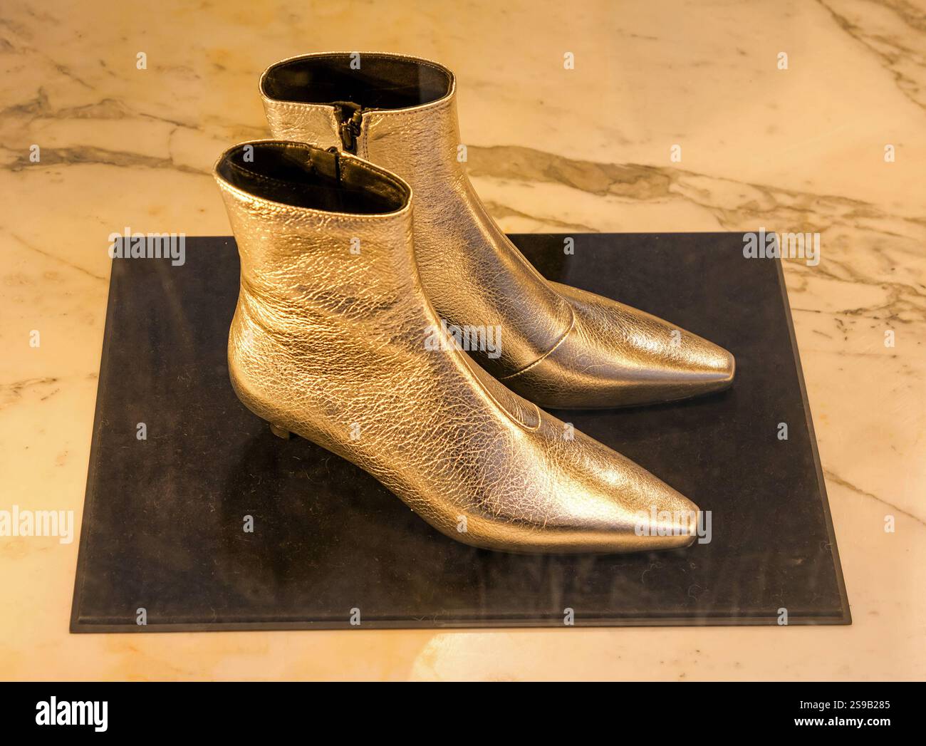 Gold metallic boots hi-res stock photography and images - Alamy