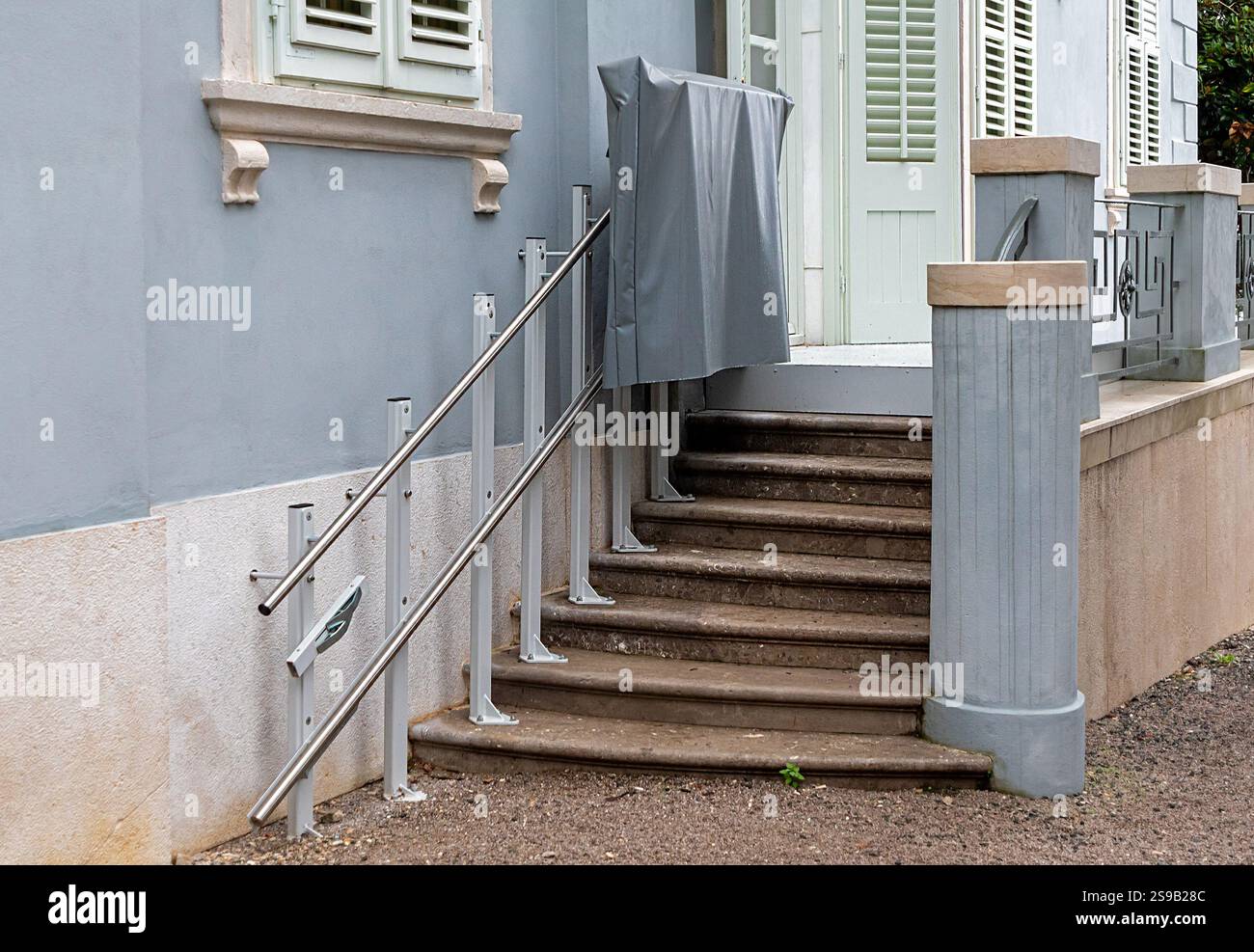 Retro house exterior with stairs on corner outside Stock Photo - Alamy