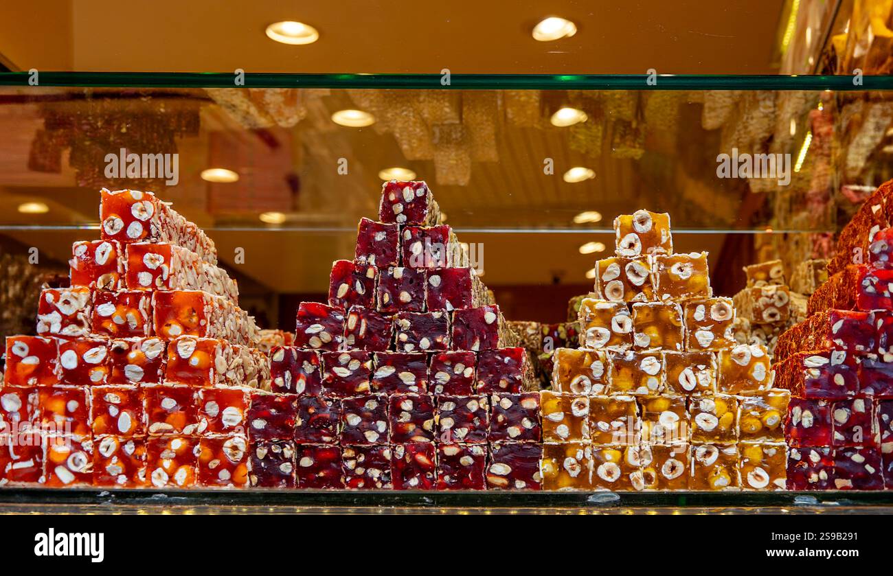 Deliciously colorful Turkish delights stacked neatly in a glass window ...