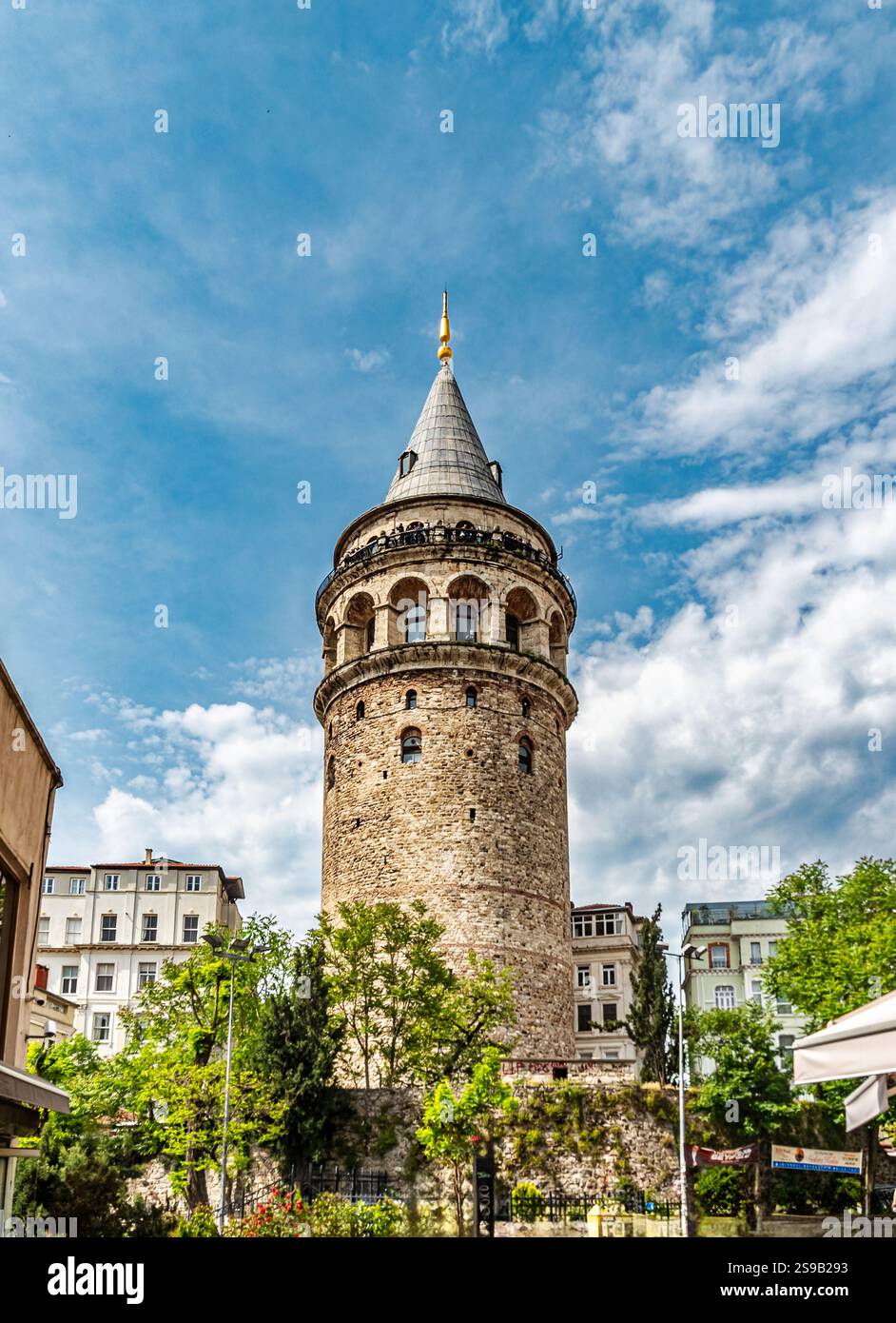 An iconic historical stone tower located in Istanbul, surrounded by ...