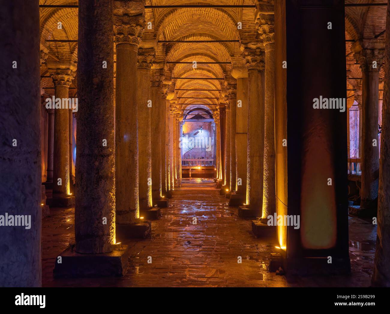 A view of an ancient underground room with columns, dramatically ...