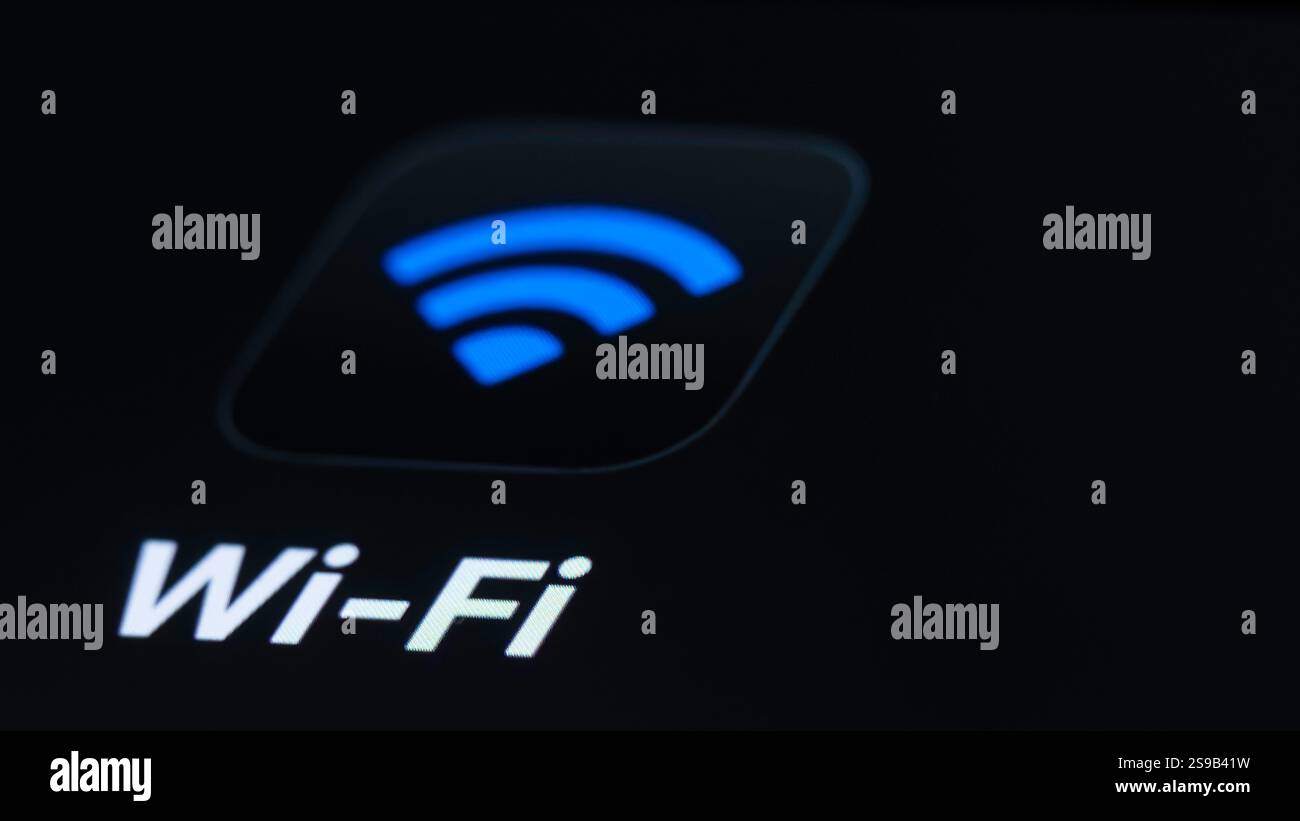 SYMBOL - 25 January 2025, Baden-Württemberg, Rottweil: The Wi-Fi lettering and the Wi-Fi logo ...