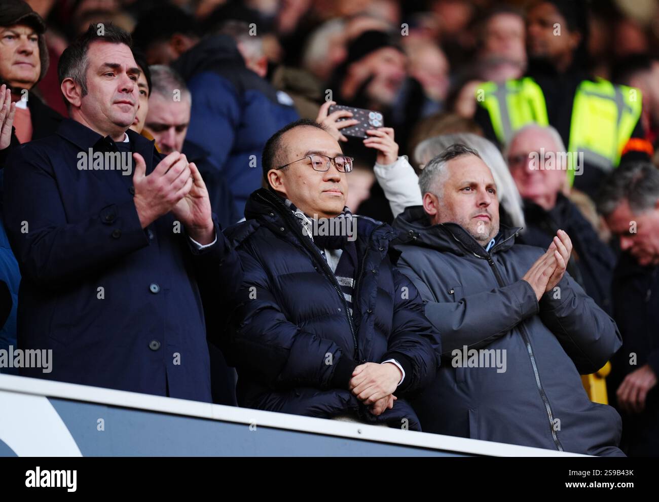 Wolverhampton Wanderers executive chairman Jeff Shi (centre), sporting ...