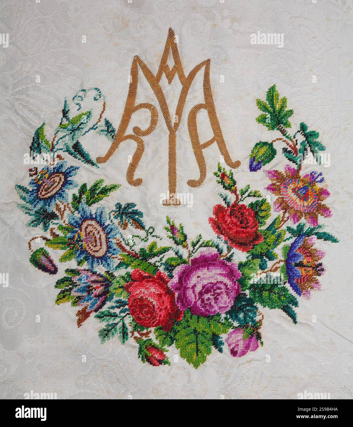 The detail of marianic initials from catholic vestment from 19. cent ...