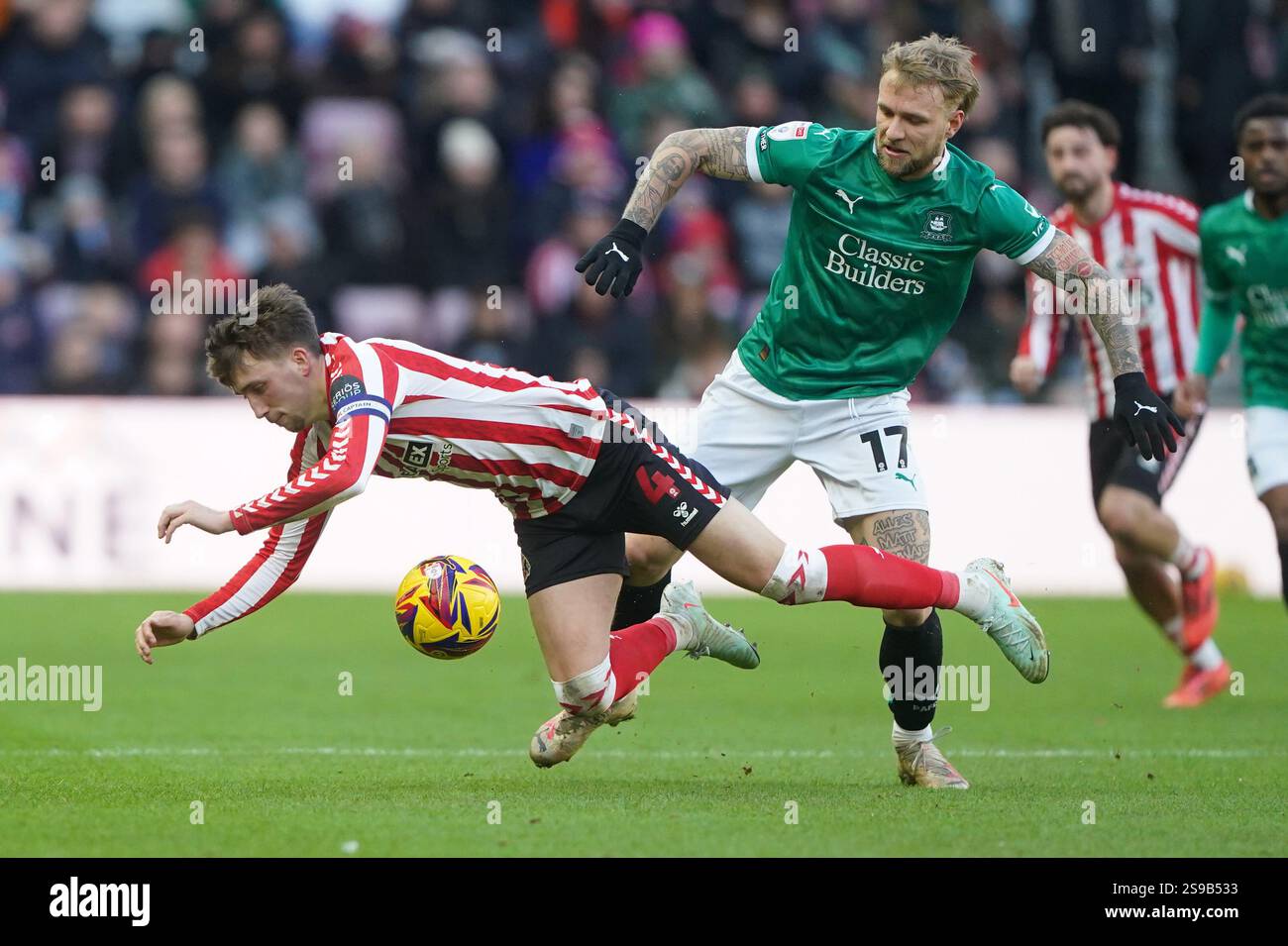 Sunderland's Dan Neil (left) and Plymouth Argyle's Lewis Gibson battle ...