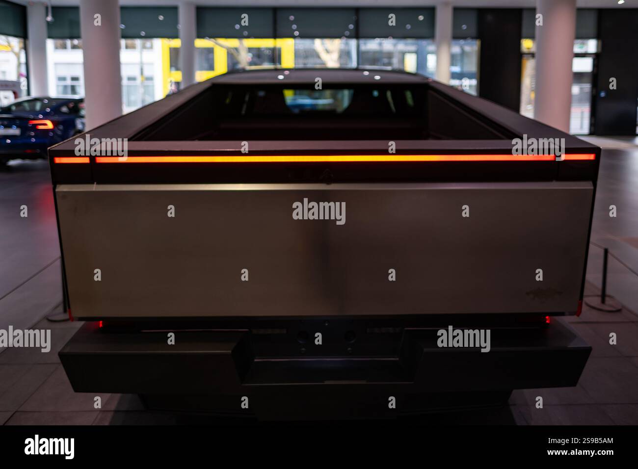 futuristic sleek silver Tesla Cybertruck foundation, ev redefining ...