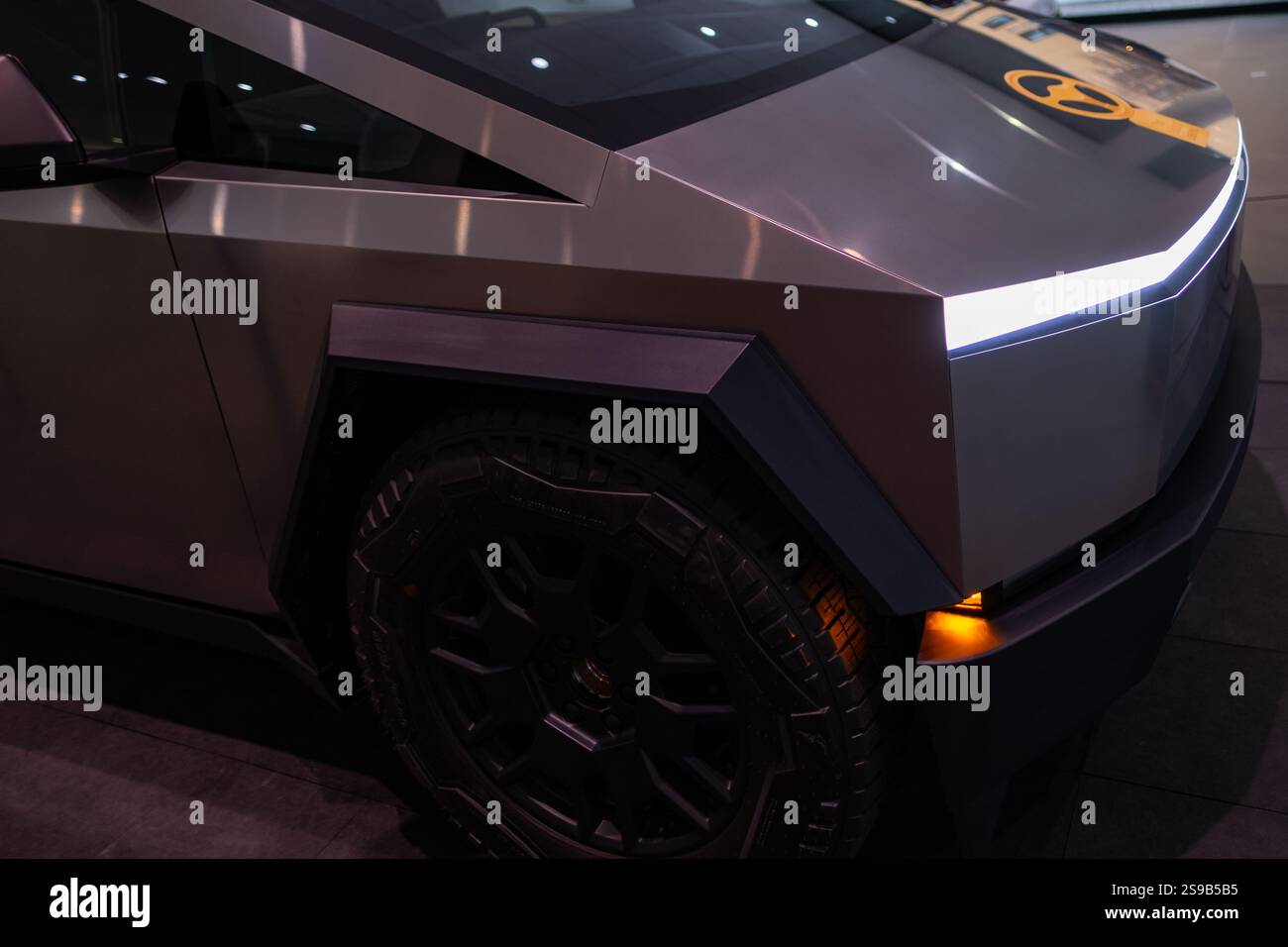 futuristic sleek silver Tesla Cybertruck foundation, ev redefining ...