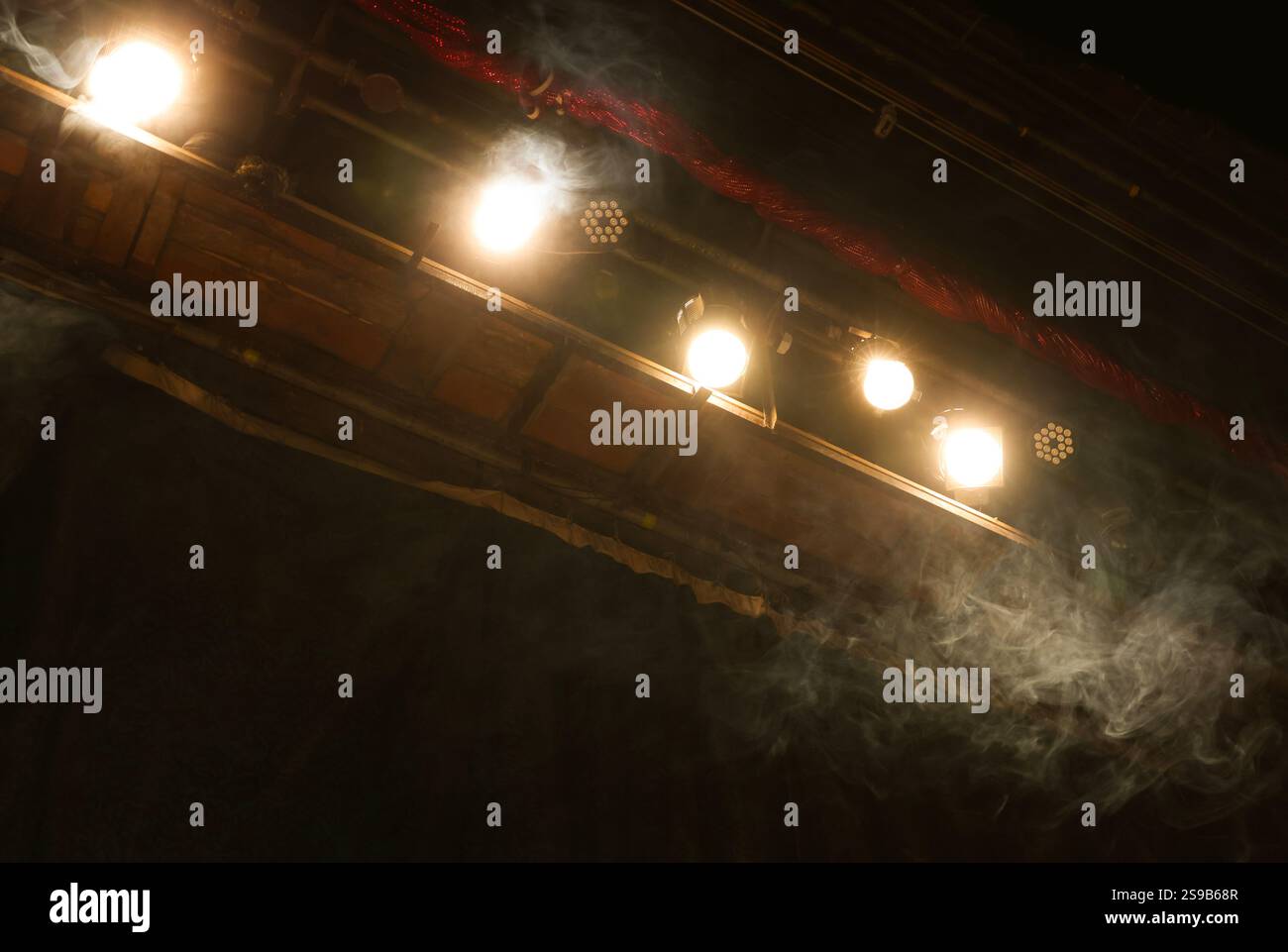 Professional spotlights and smoke on stage in theatre, low angle view ...