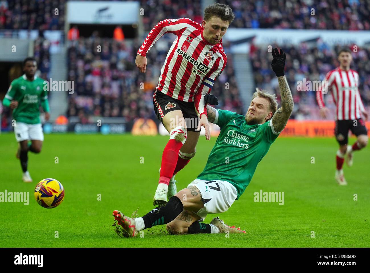 Plymouth Argyle's Lewis Gibson (right) and Sunderland's Dan Neil battle ...