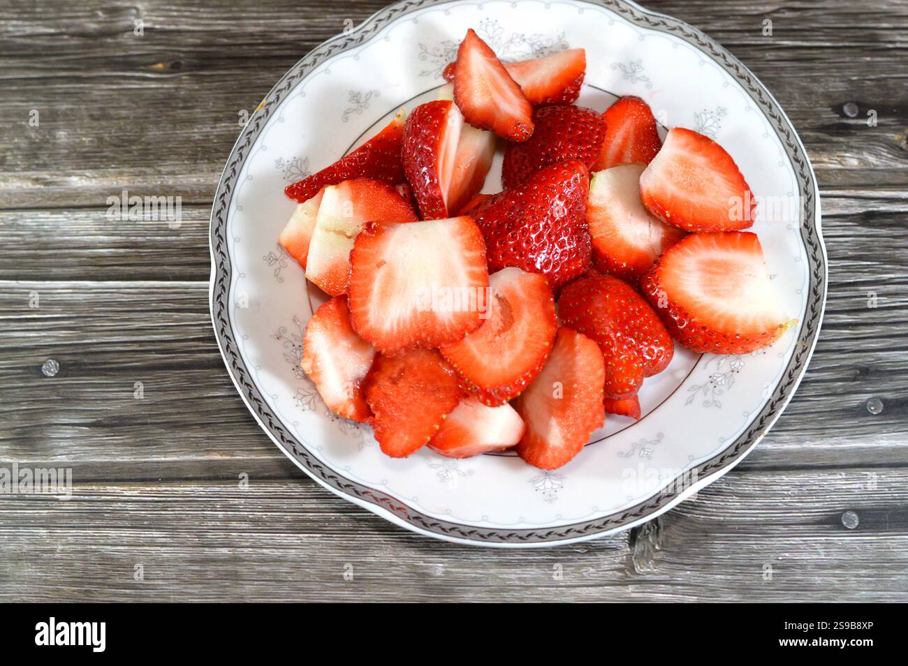 Strawberry fruit, a widely grown hybrid species of the genus Fragaria ...