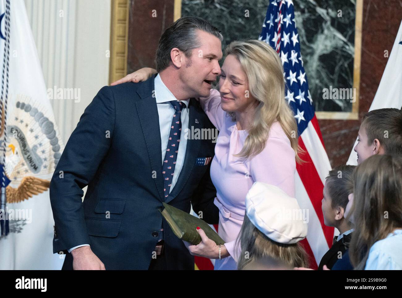 United States Secretary of Defense Pete Hegseth hugs his wife, Jennifer ...