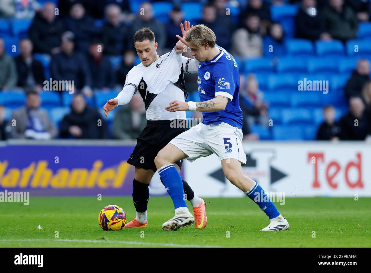 Derby County's Jerry Yates (left) and Cardiff City's Jesper Daland ...