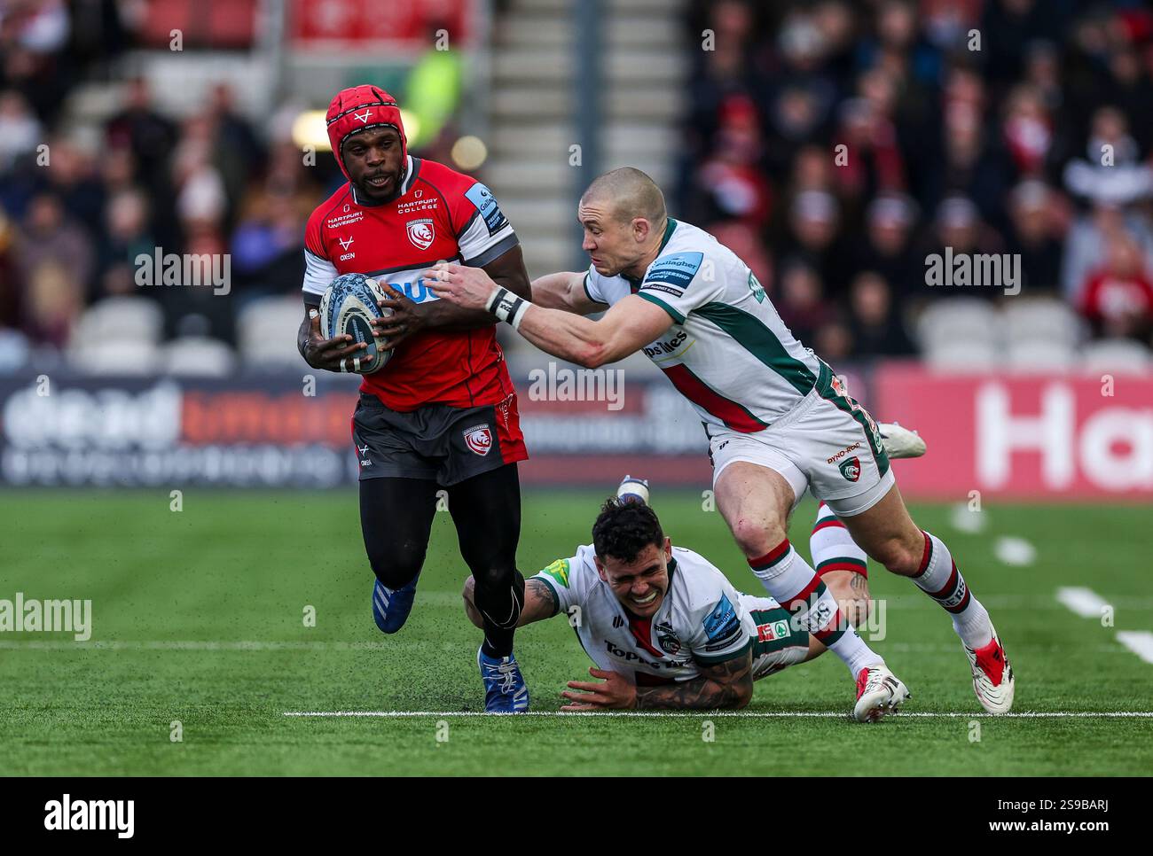 Gloucester's Christian Wade is tackled by Leicester Tigers Izaia Perese ...