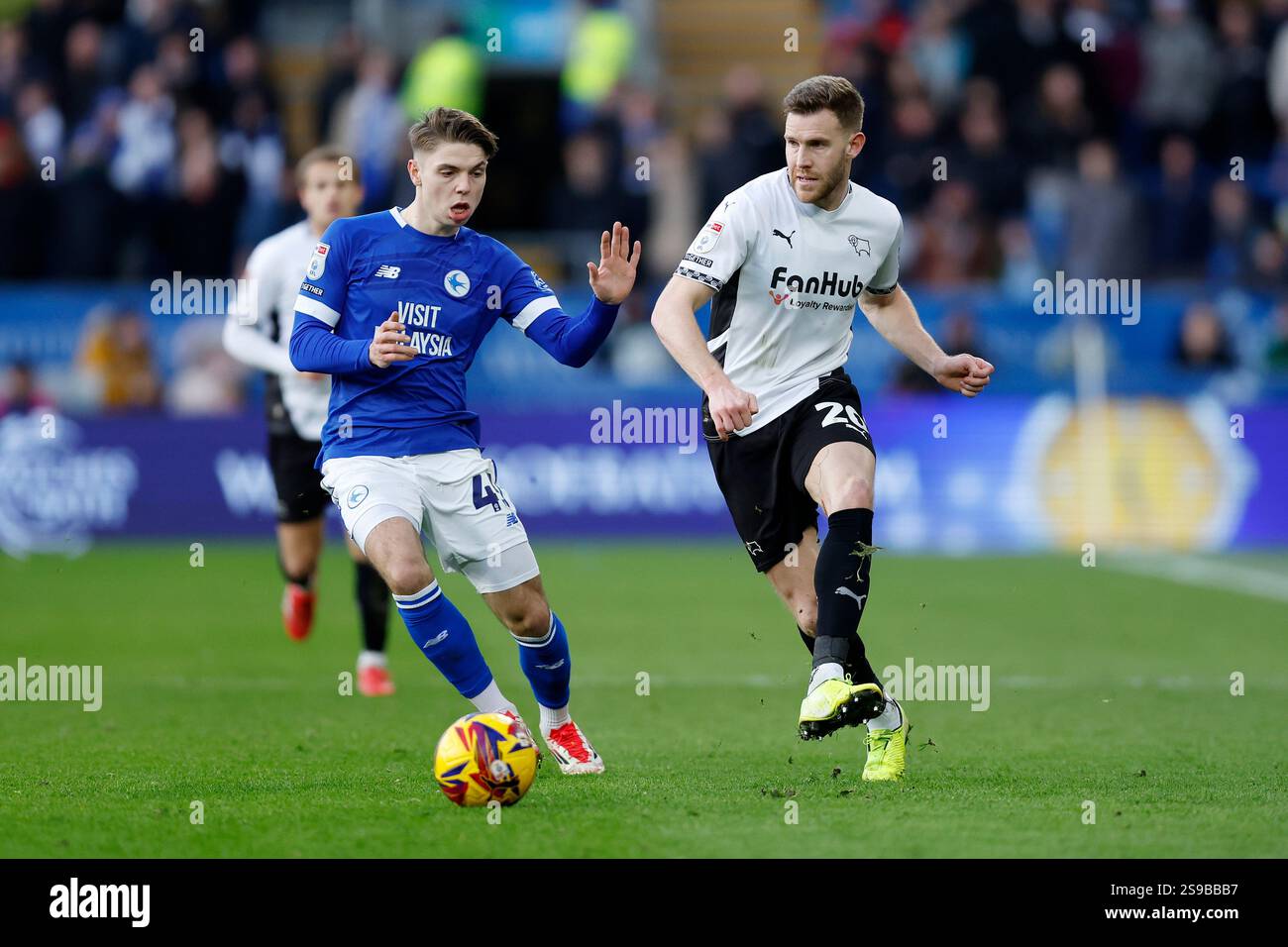 Cardiff City's Cian Ashford (left) and Derby County's Callum Elder ...