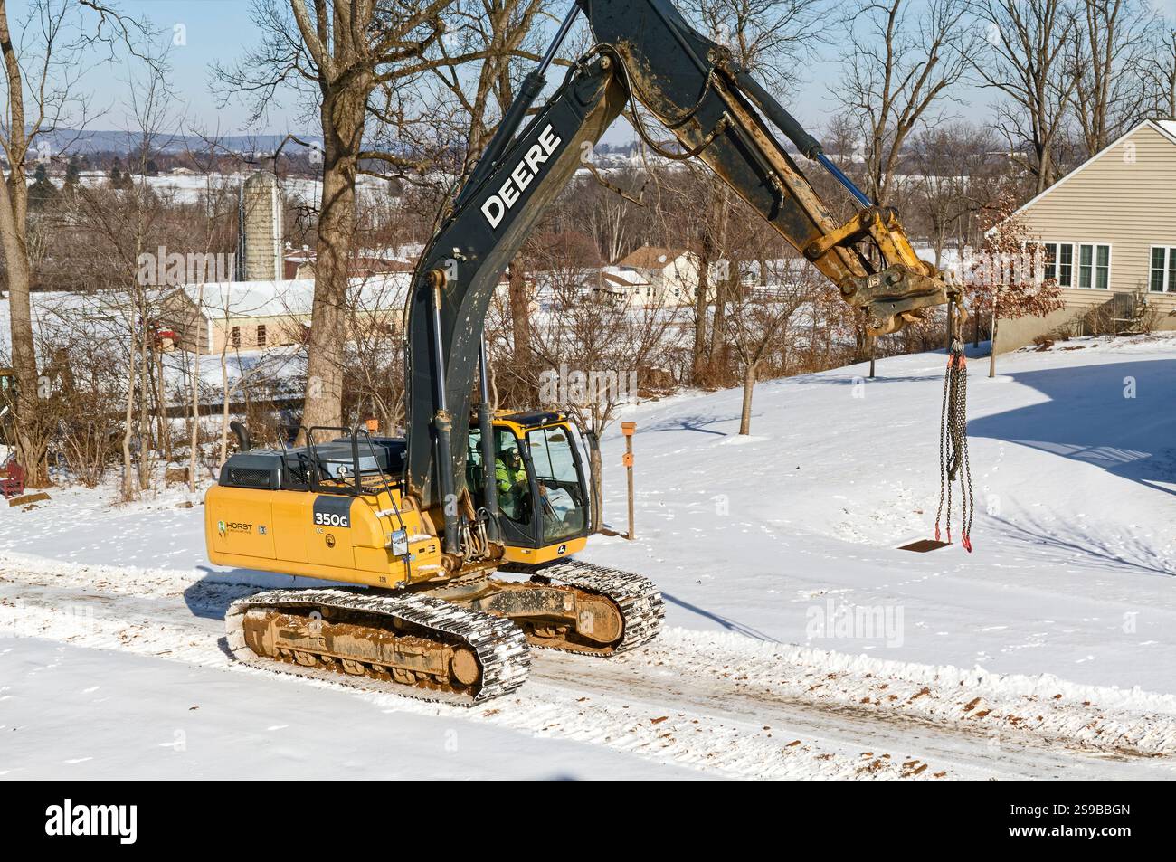 crane at work, heavy equipment, moving forward, chains gathered up, job ...